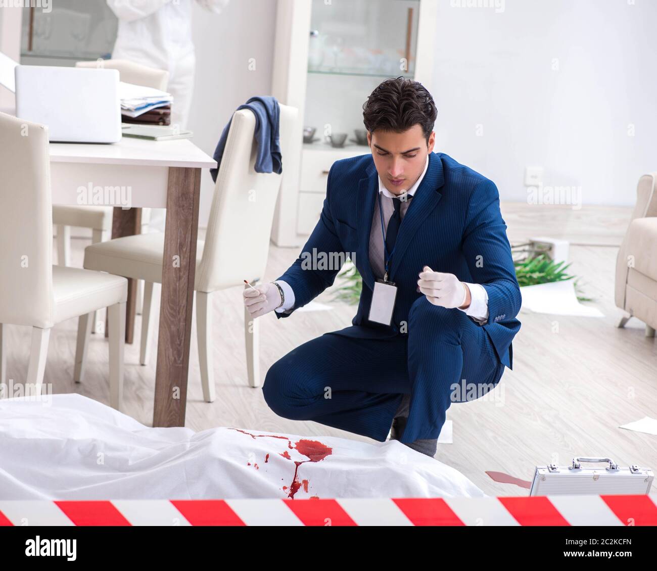 The forensics investigator at the scene of office crime Stock Photo - Alamy