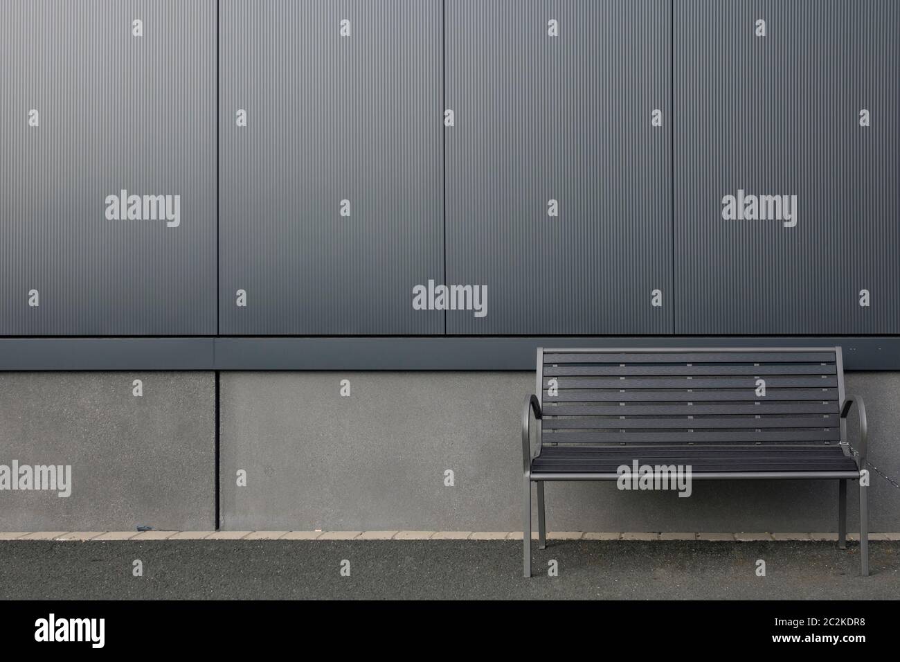 Modern outdoor relaxation area with bench outside Stock Photo - Alamy