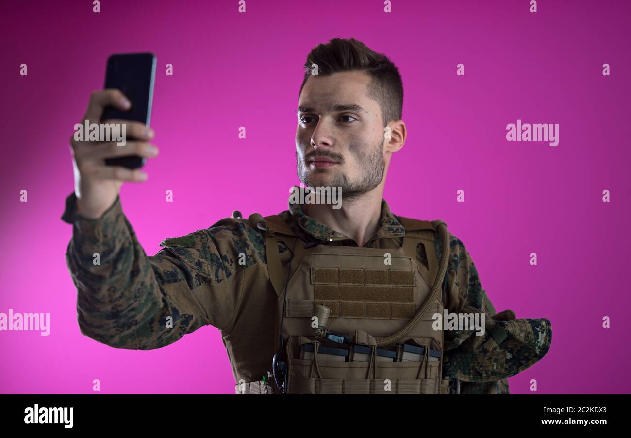 Happy military man using smartphone hi-res stock photography and images ...
