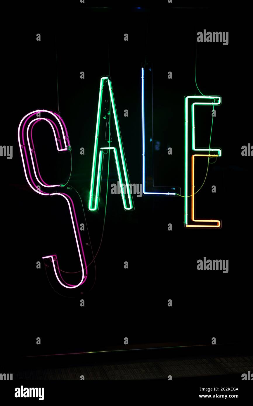Neon Lights Sale Sign in Shop Window Stock Photo - Alamy