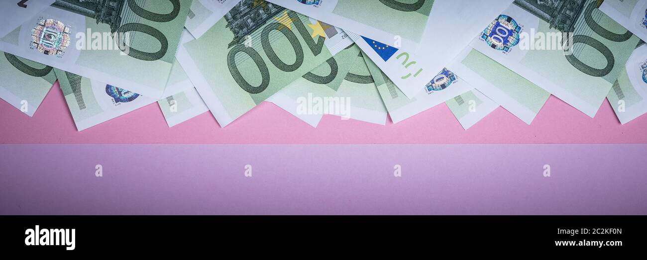 Euro cash on a lilac, purple and pink background. Euro Money Banknotes ...