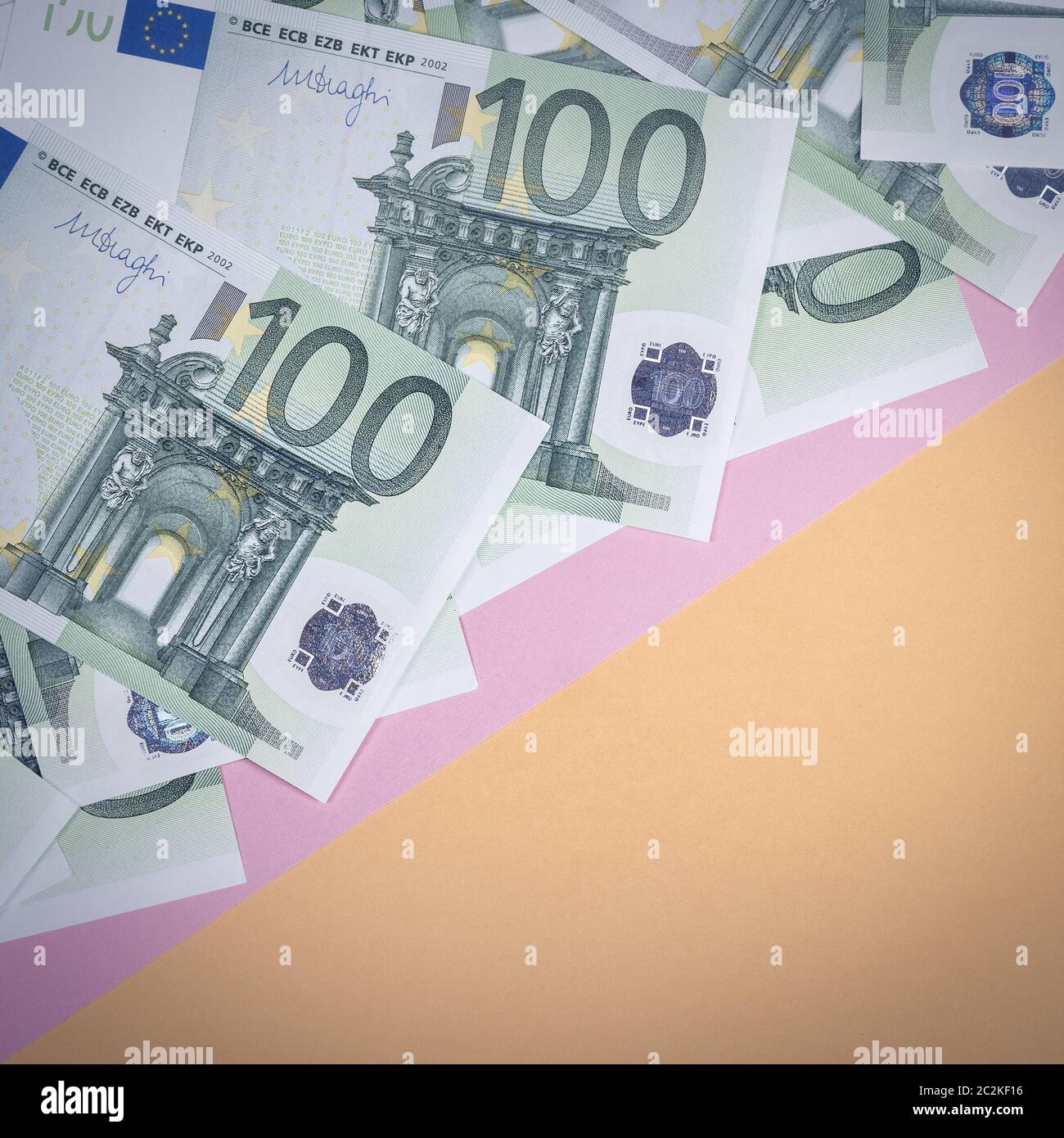 Euro cash on a yellow and pink background. Euro Money Banknotes. Euro ...