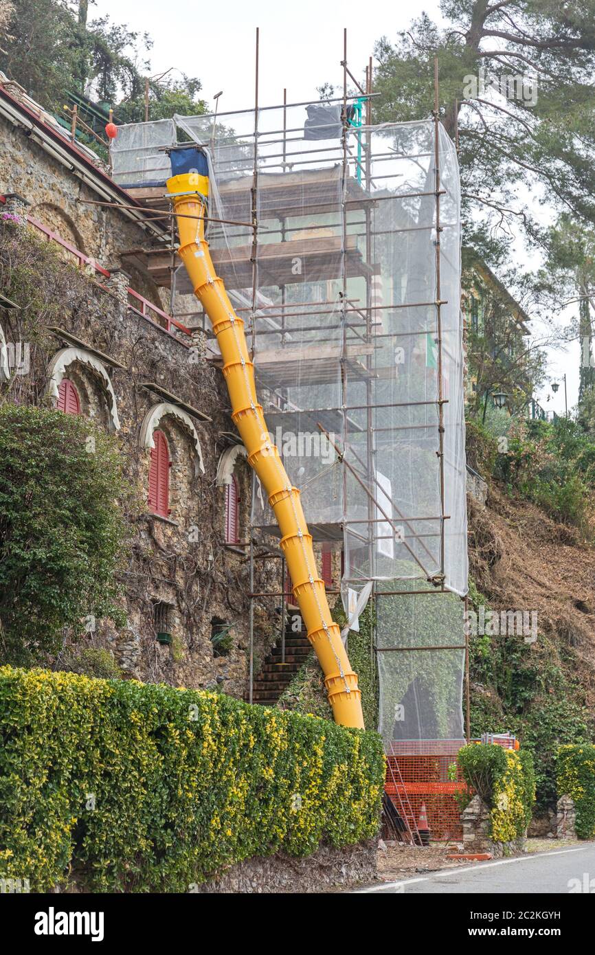 Debris Chute and Scaffolding at Construction Site Stock Photo - Alamy