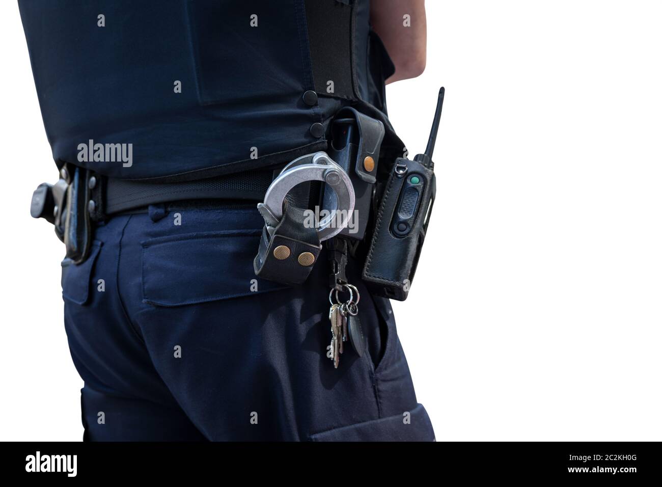 Police officer, with gun belt, handcuffs phone and pepper-spray ...