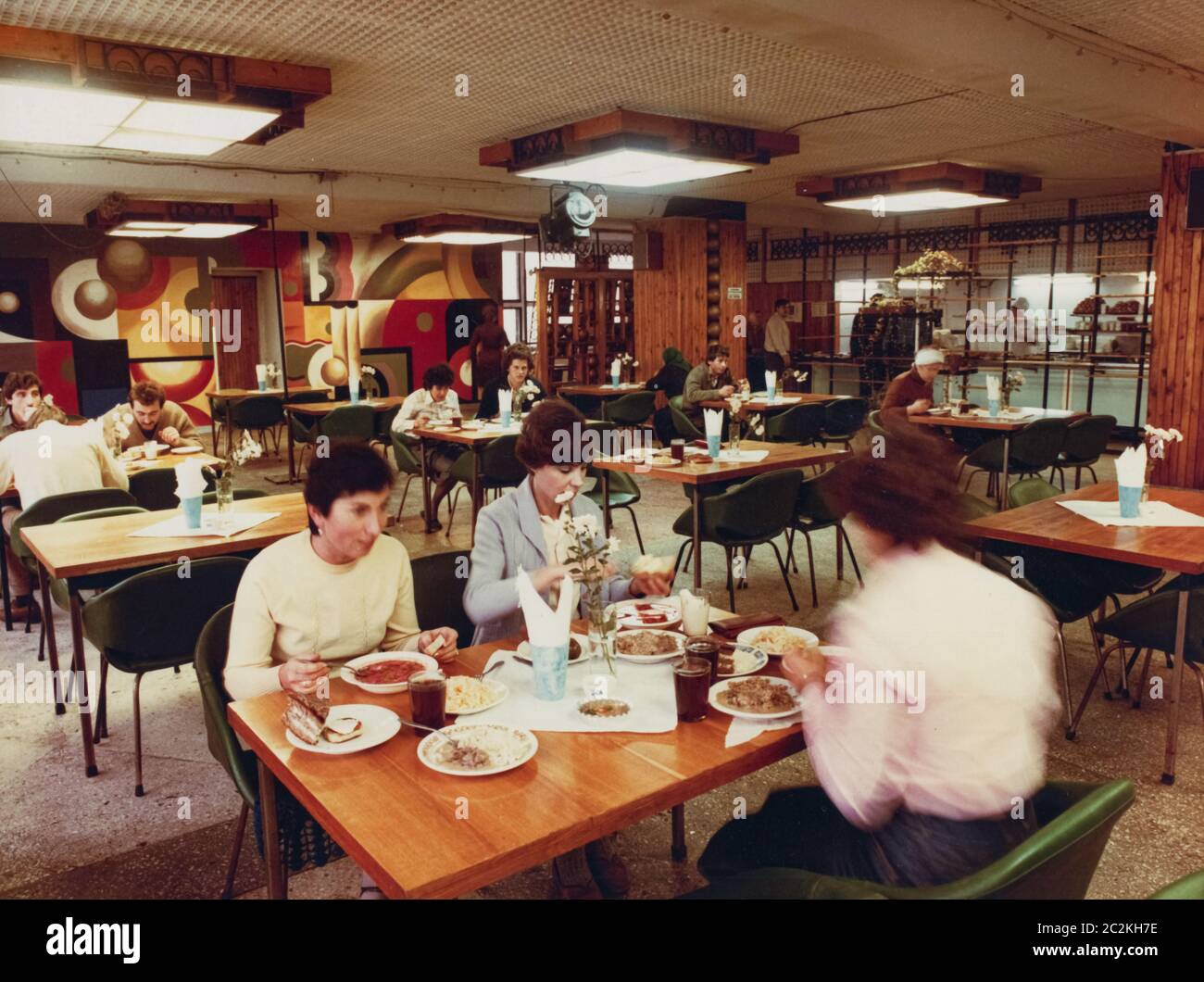 CIRCA 1980. Canteen of soviet factory. Employees have dinner or lunch ...