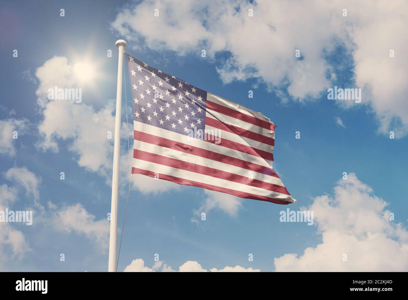 American flag waving against cloudy hi-res stock photography and images ...