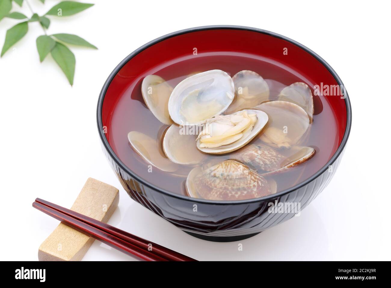 Japanese soy sauce soup with asari clams in a bowl on white background ...