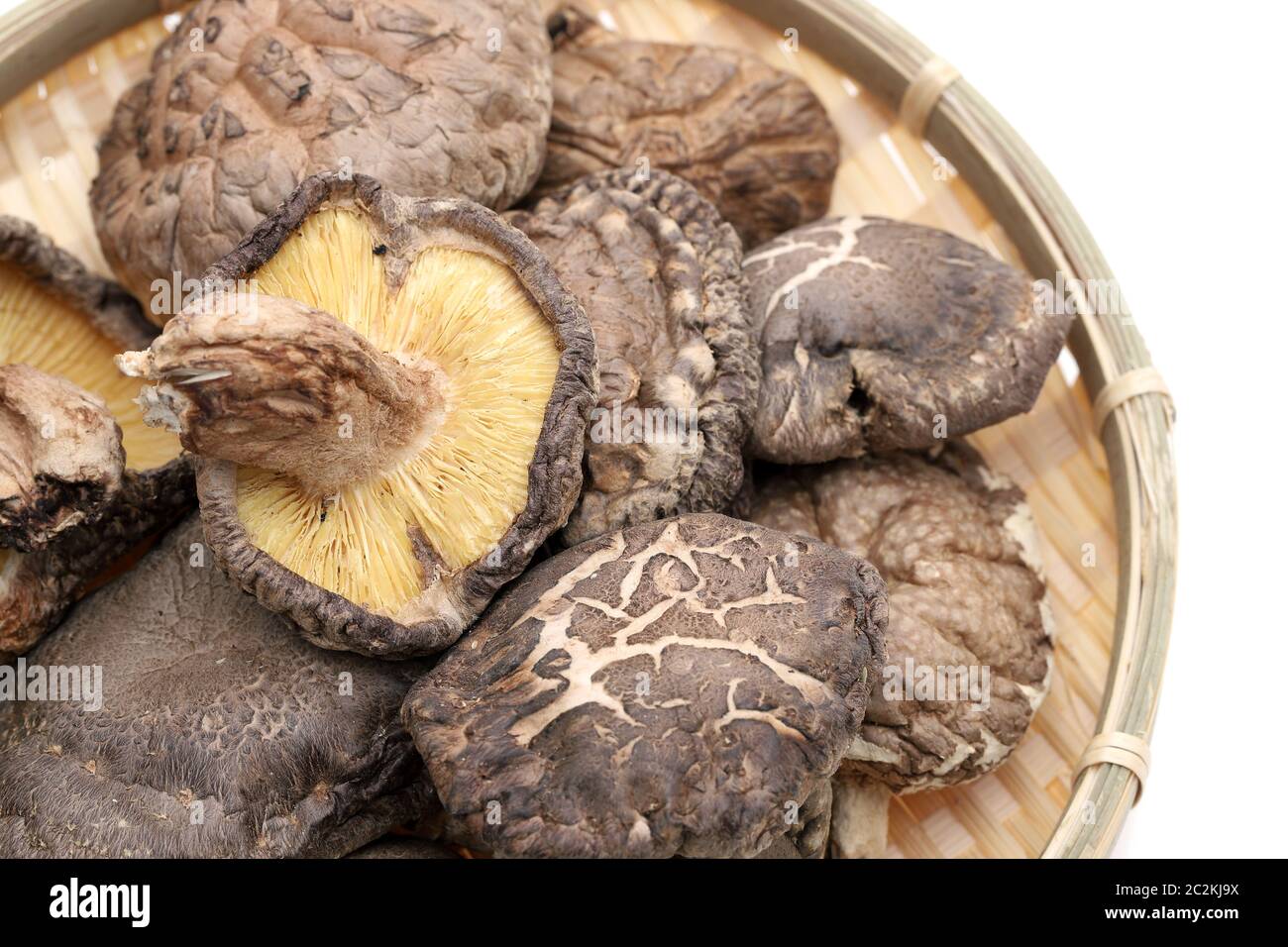 Japanese dried shiitake mushrooms in a bamboo basket hi-res stock ...
