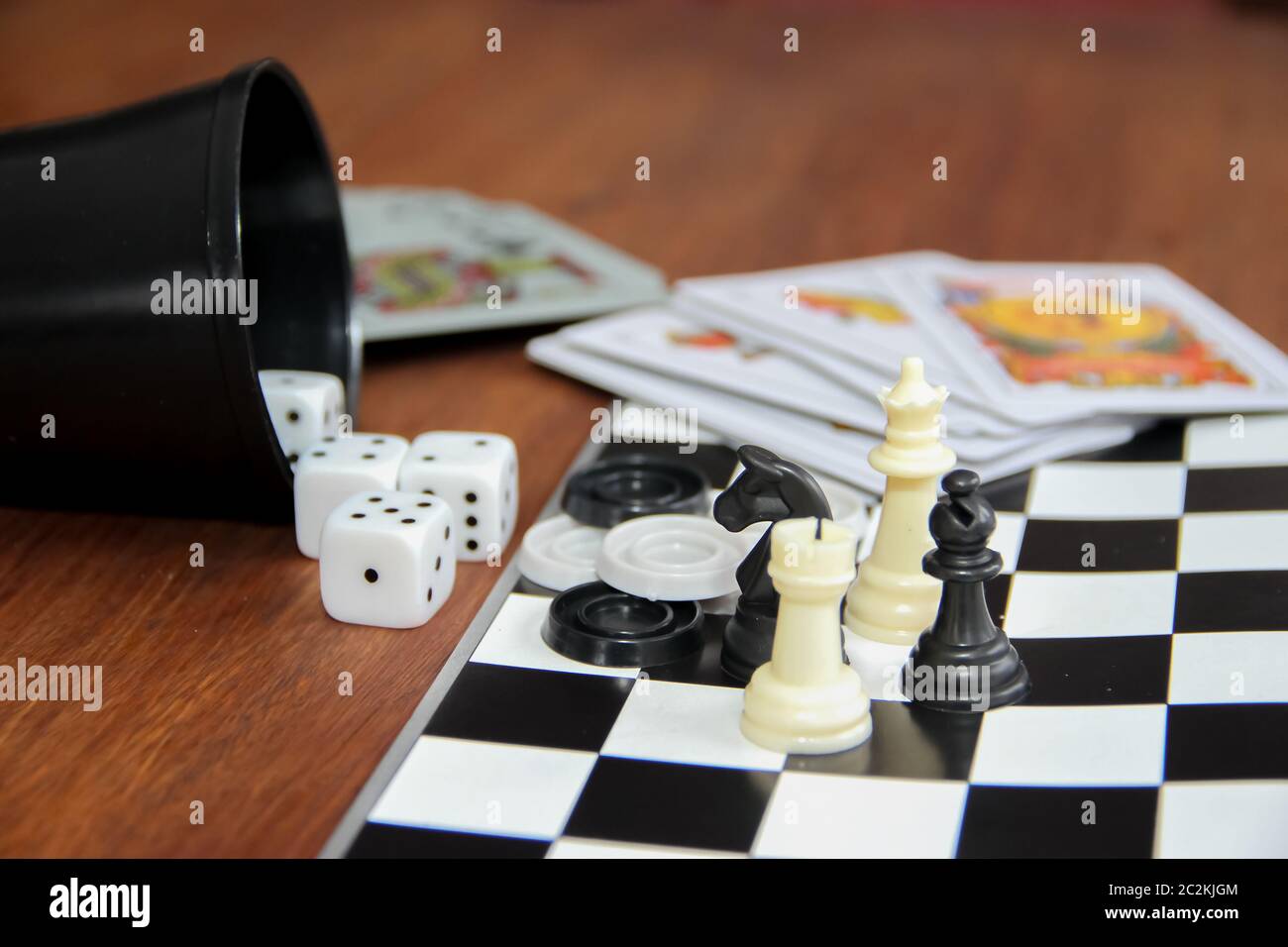 mix of goblet table games dice spanish poker cards chess and checkers ...