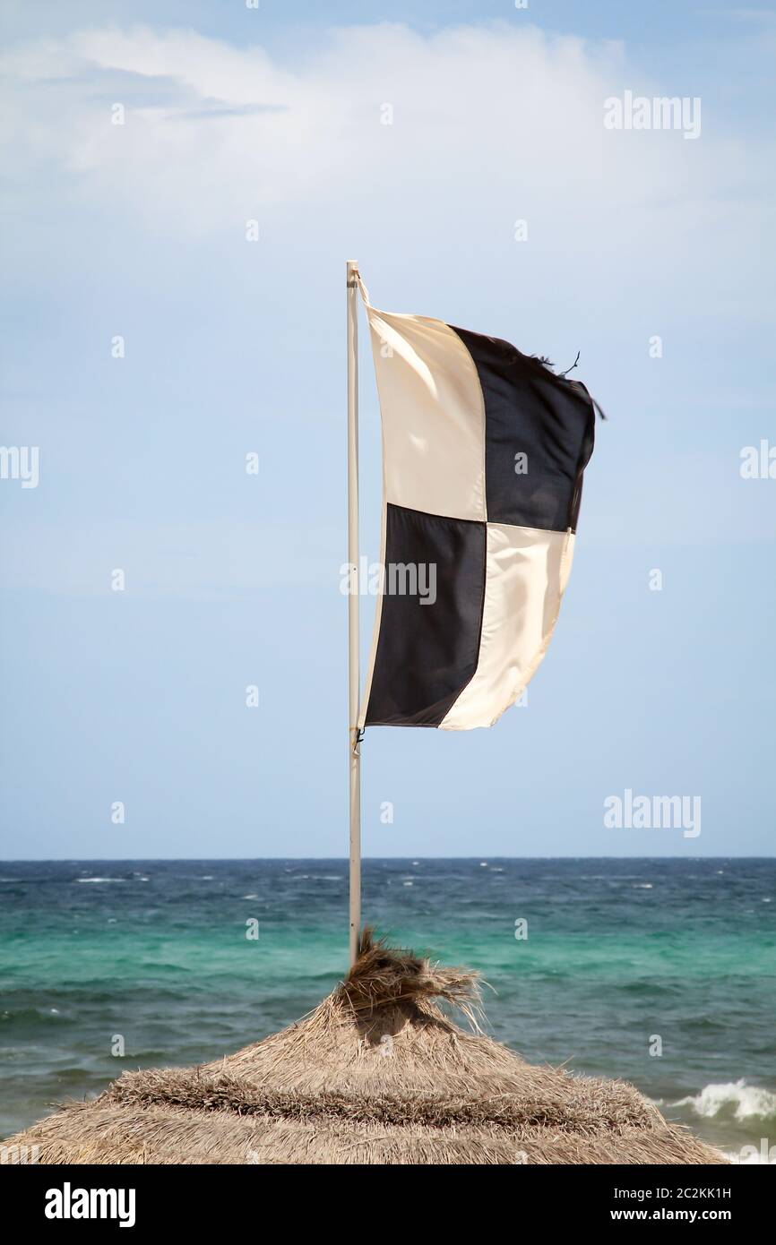 flags on the beach indicate dangers Stock Photo - Alamy