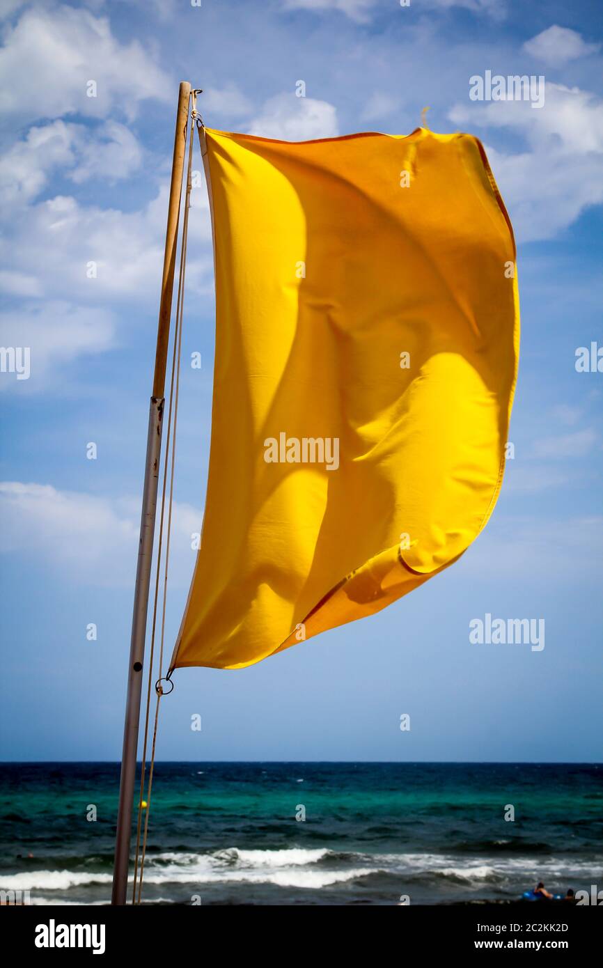 flags on the beach indicate dangers Stock Photo - Alamy