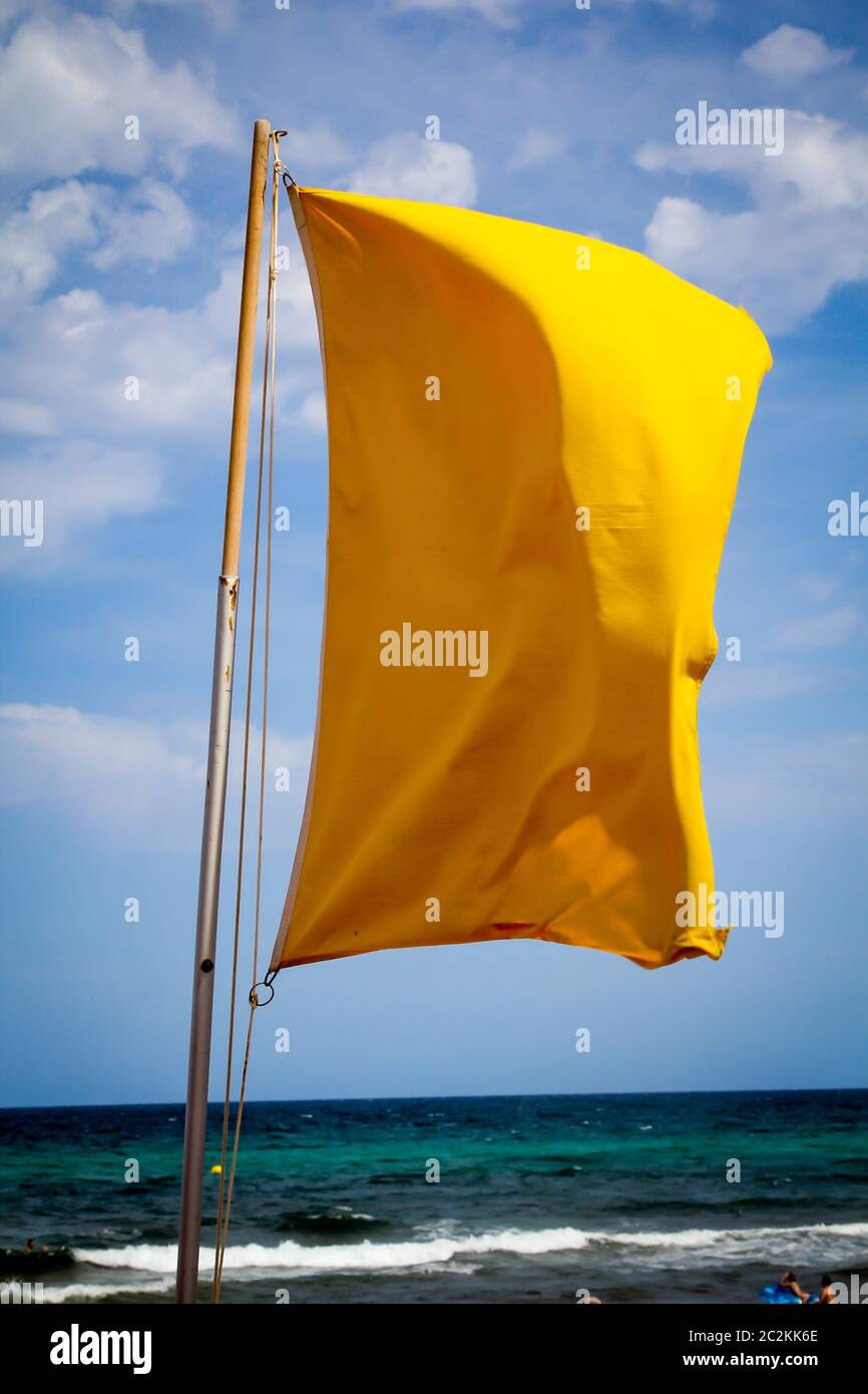 flags on the beach indicate dangers Stock Photo - Alamy
