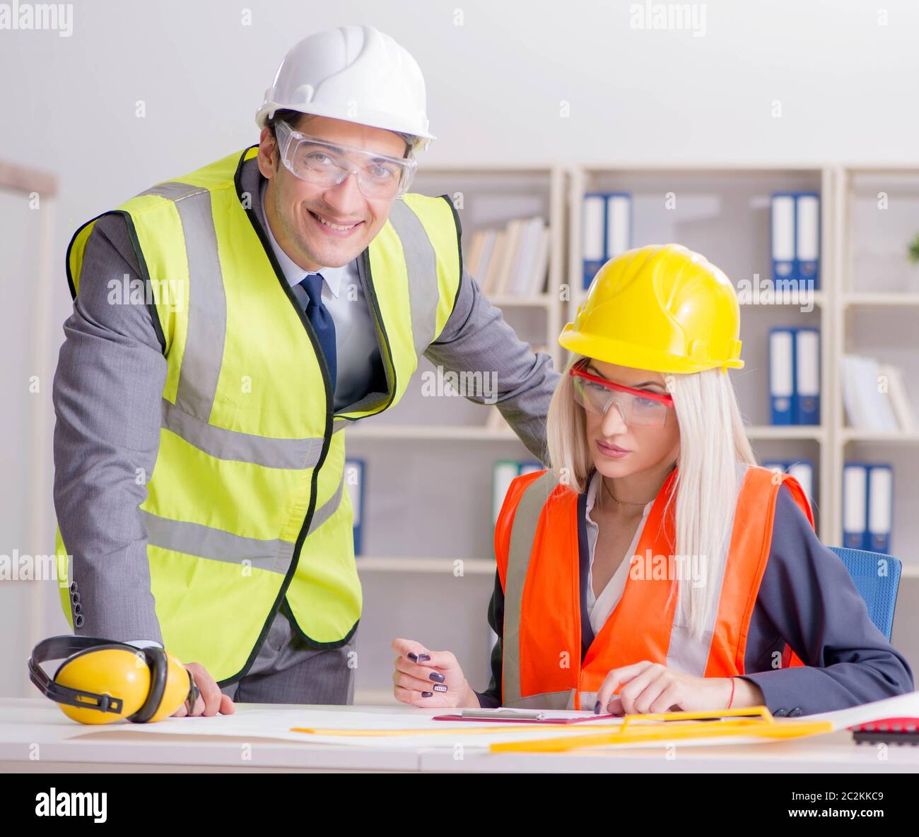 Construction workers having discussion in office before starting project Stock Photo - Alamy