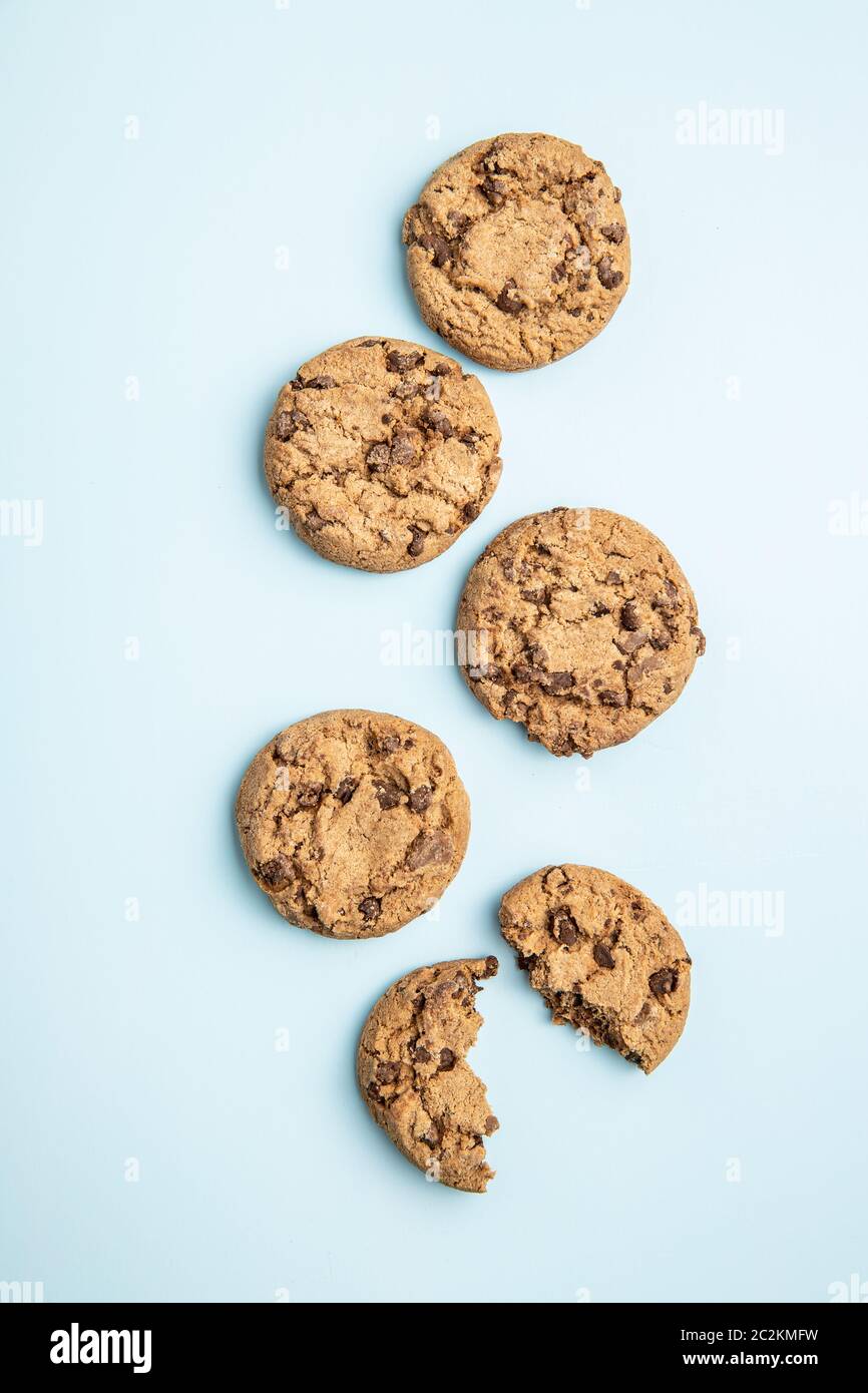 Sweet biscuits. Chocolate cookies on blue table. Top view Stock Photo ...