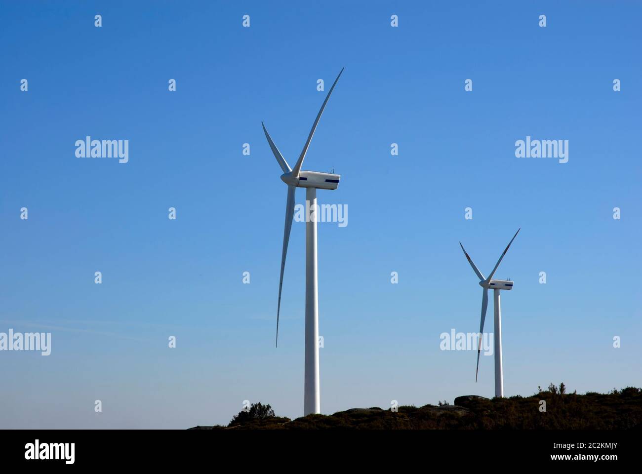 white wind turbine in the top of the mountain Stock Photo - Alamy