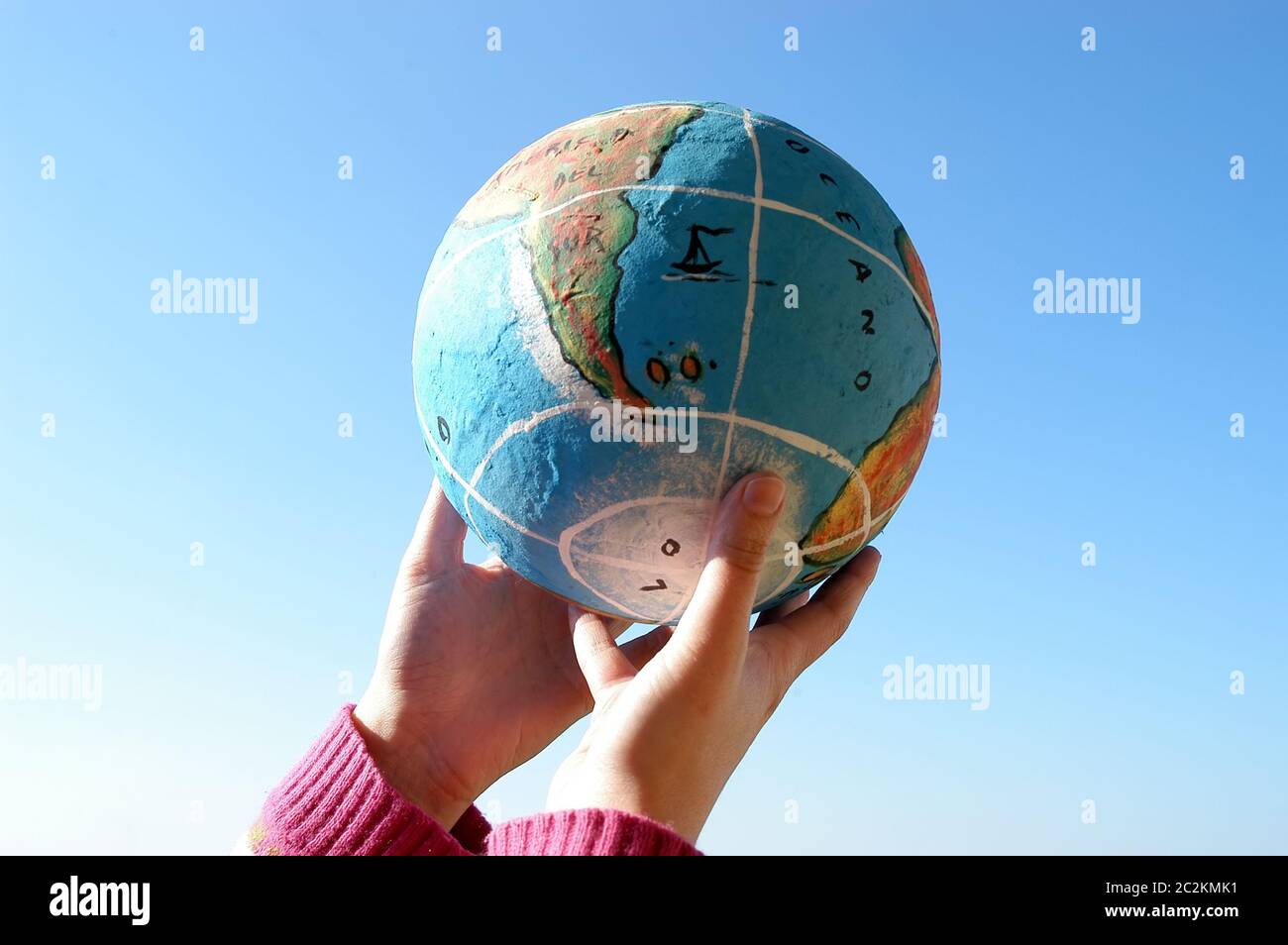 hands holding a globe Stock Photo - Alamy