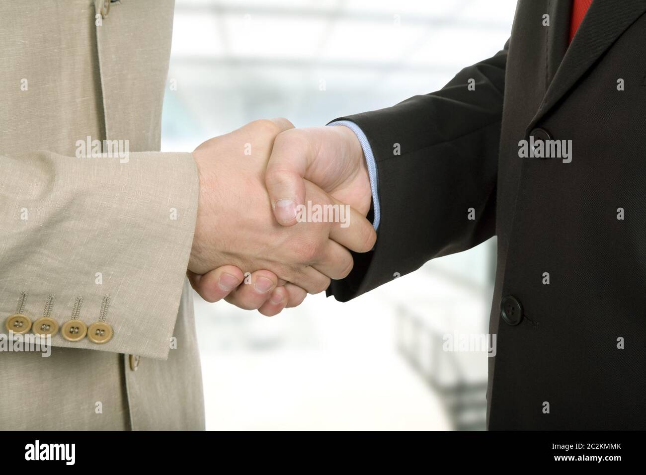 Business team hand shake at the office Stock Photo - Alamy