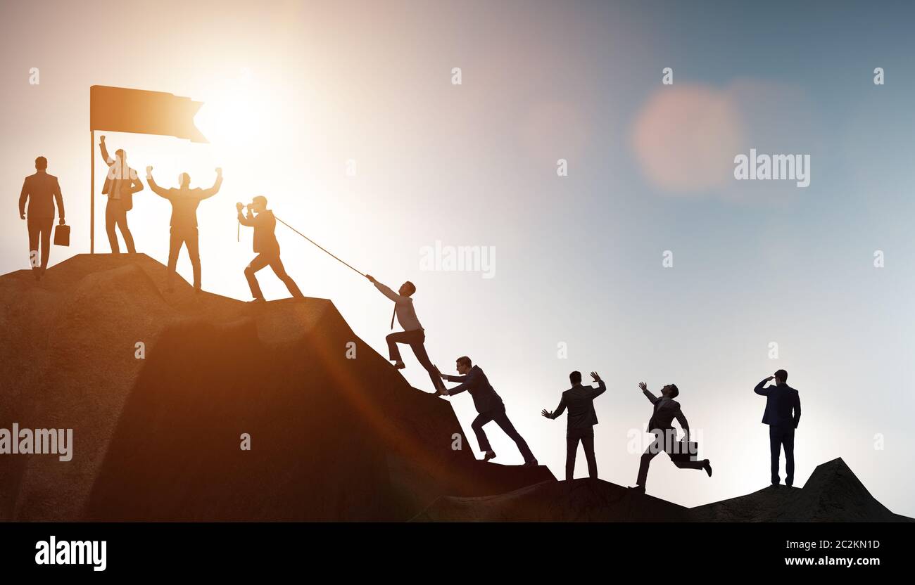 Concept of teamwork with team climbing mountain Stock Photo - Alamy