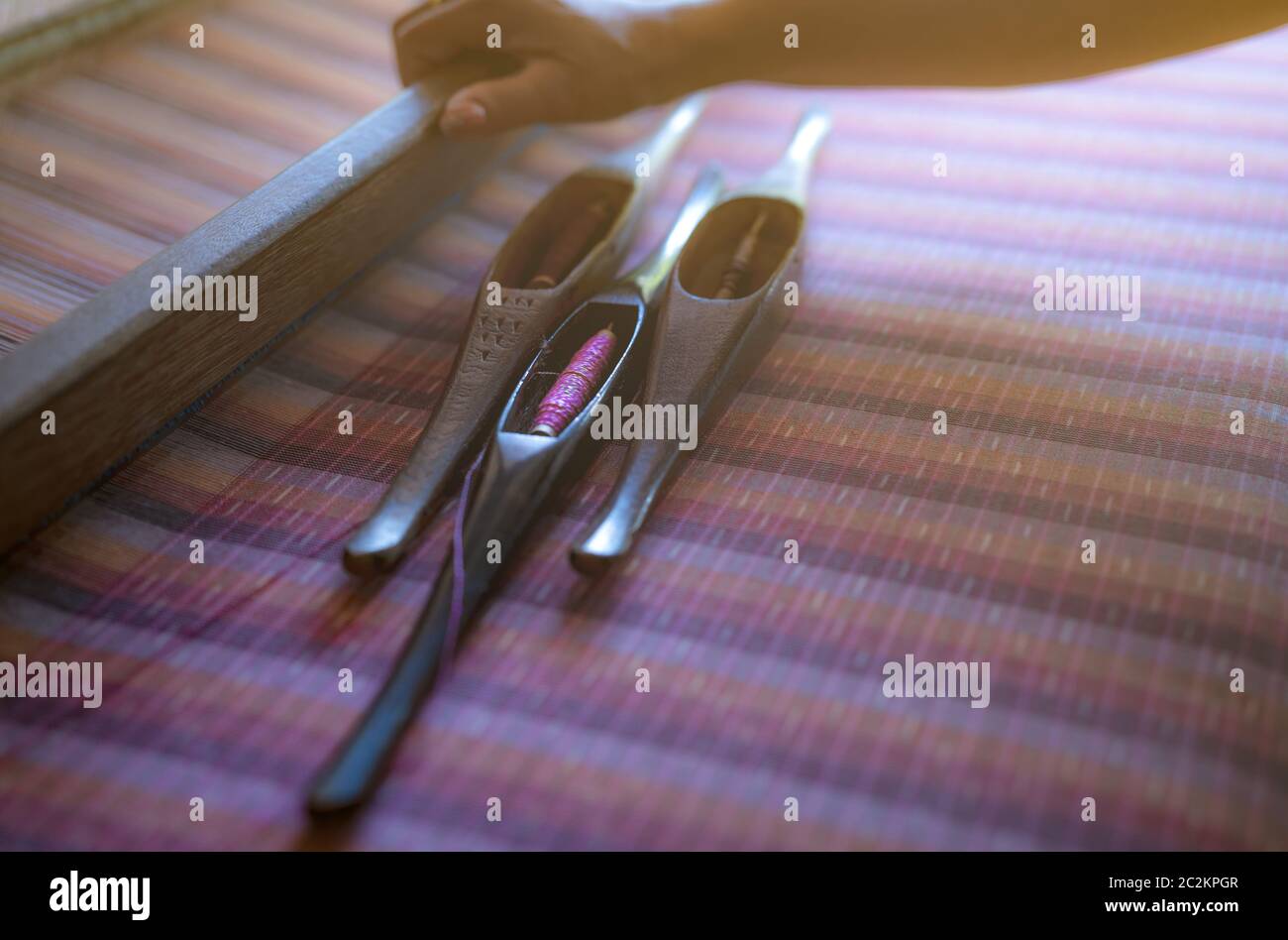 Woman working on weaving machine for weave handmade fabric. Textile ...
