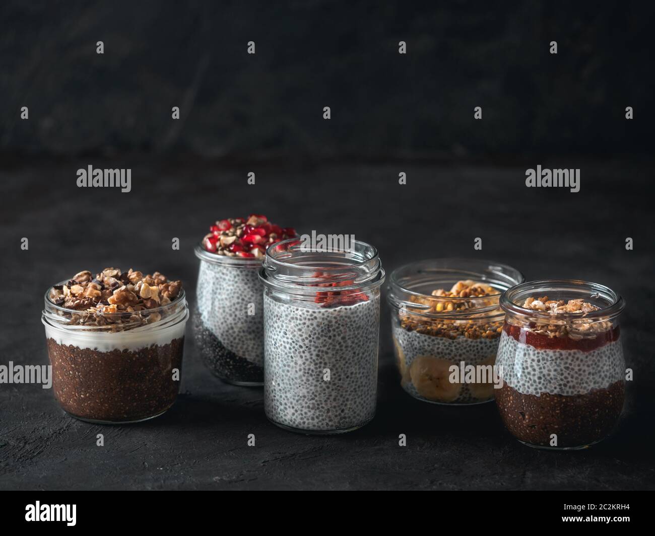 chia pudding set in different glass jars Stock Photo - Alamy