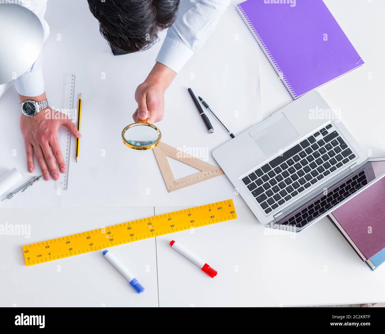 The engineer working on new project drawings Stock Photo - Alamy