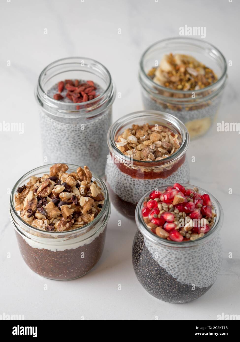 chia pudding set in different glass jars Stock Photo - Alamy