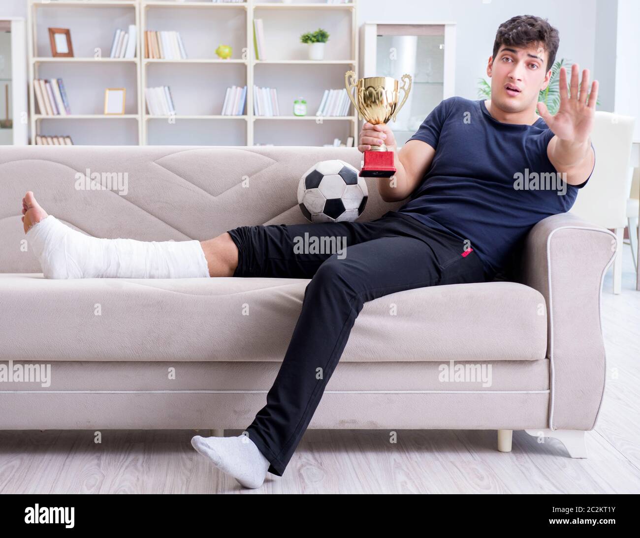 The man with broken leg recovering at home Stock Photo - Alamy