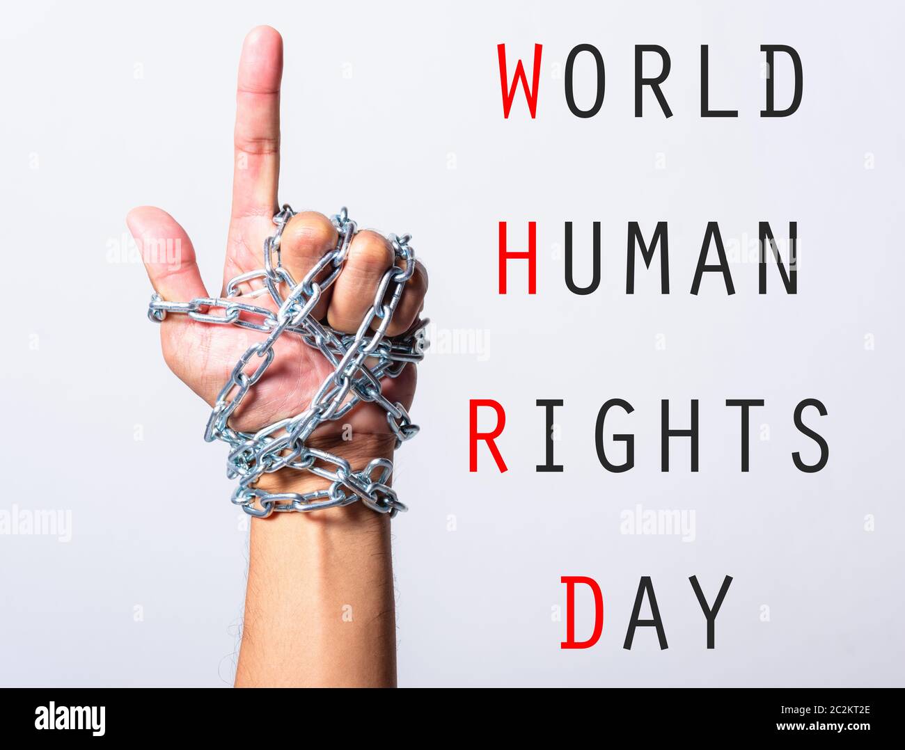 Chained fist hand point finger with WORLD HUMAN RIGHTS DAY text on ...