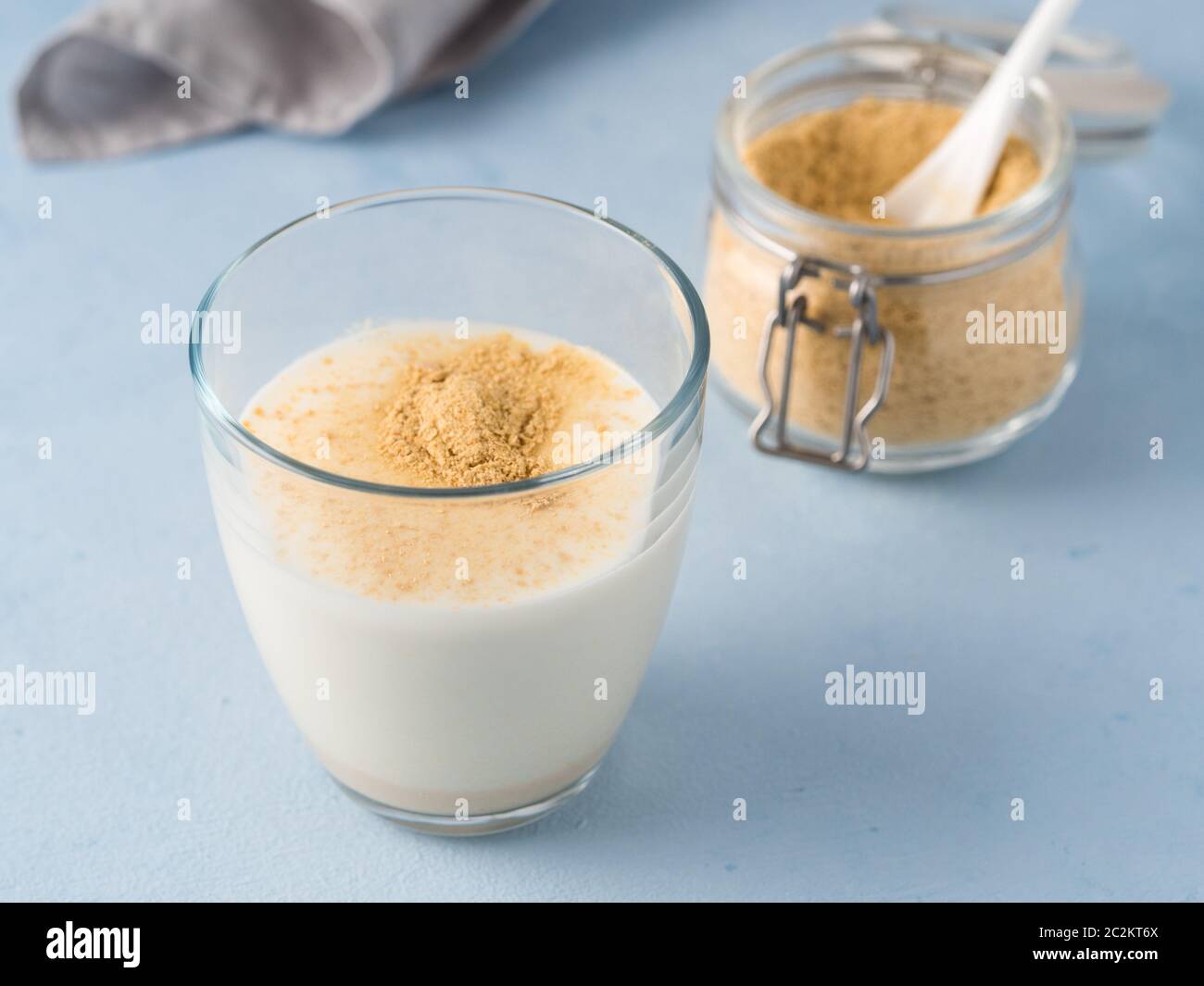 Milk and Nutritional inactive yeast top view Stock Photo - Alamy