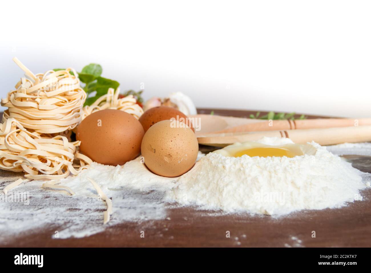 ingredients preparation spaghetti with eggs, tomatoes herbs and spices ...