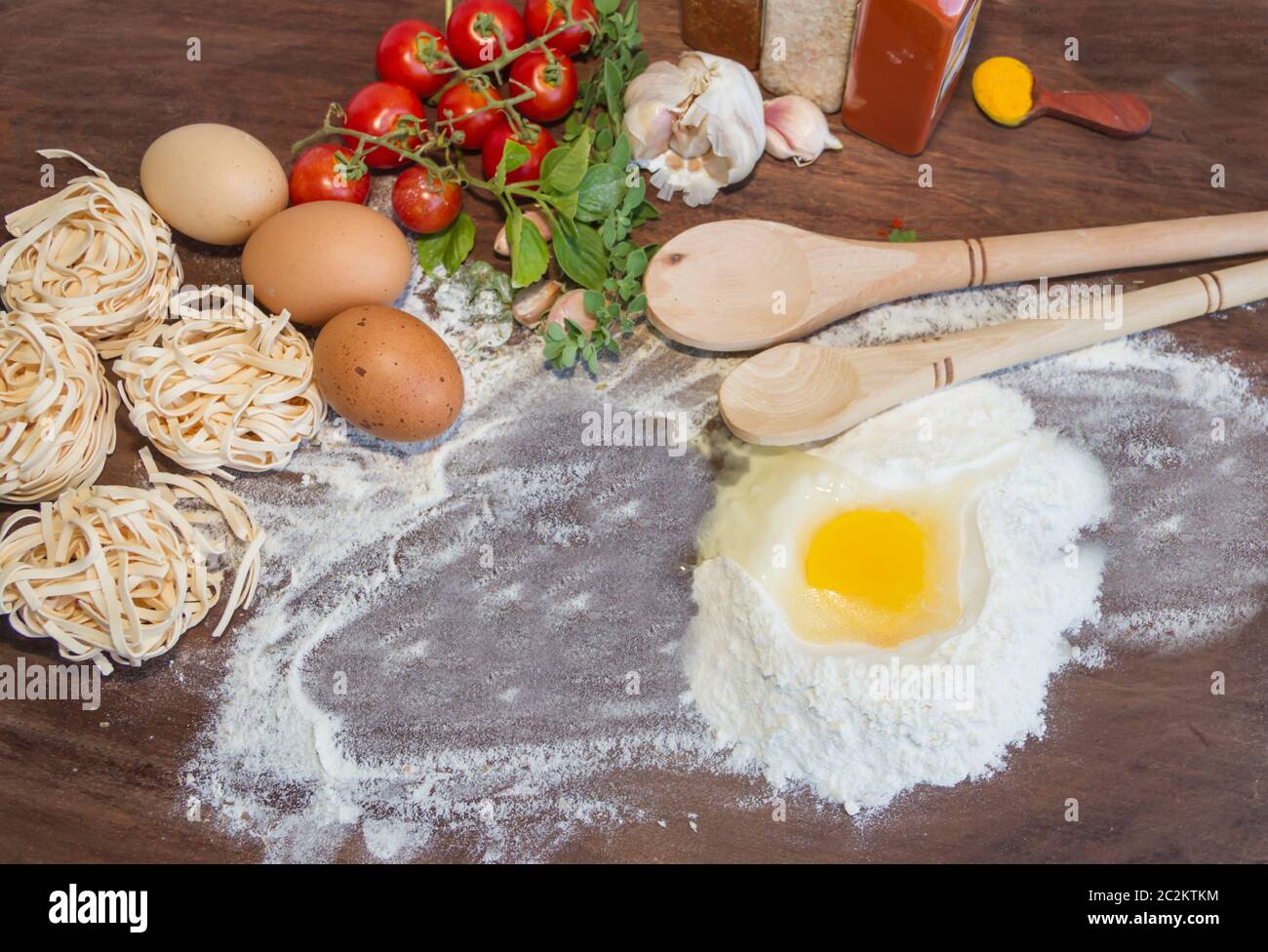 ingredients preparation spaghetti with eggs, tomatoes herbs and spices ...