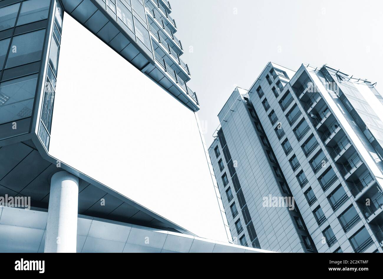 Low angle view on big outdoor advertising billboard on modern building ...