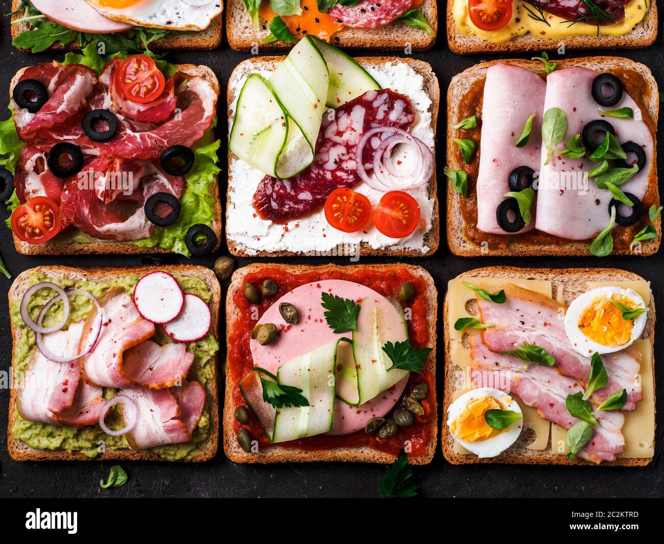 open sandwiches with different meat, top view Stock Photo - Alamy
