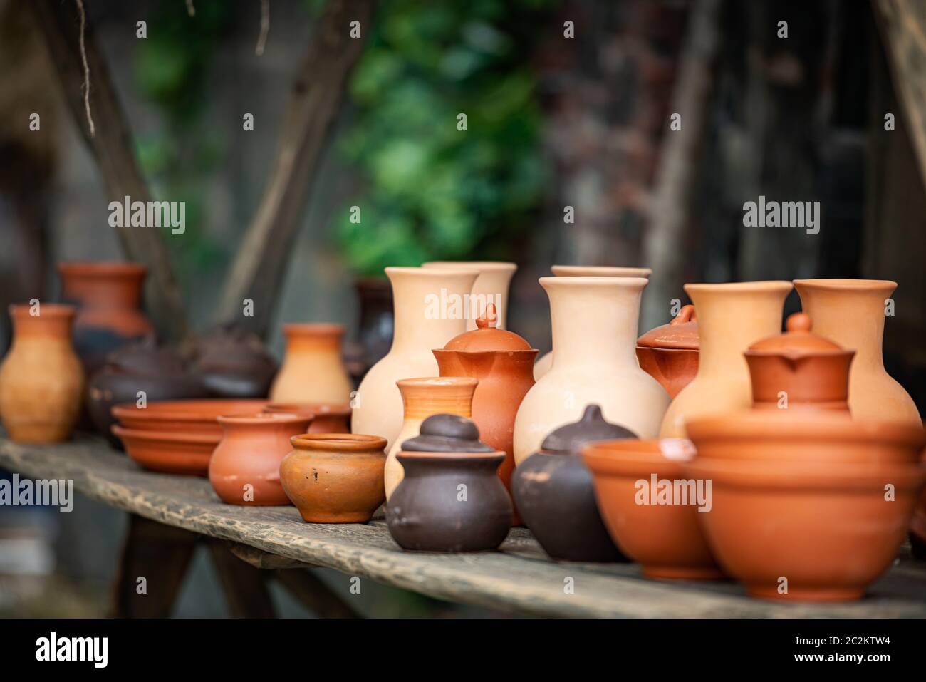 Beautiful handcrafted pottery on table in Russia Stock Photo - Alamy