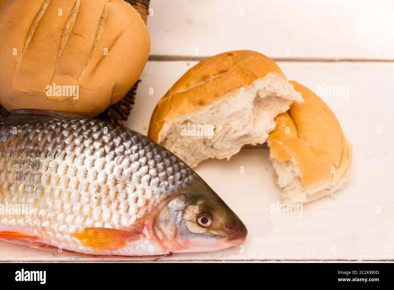 Five loaves of bread and two fish hi-res stock photography and images ...