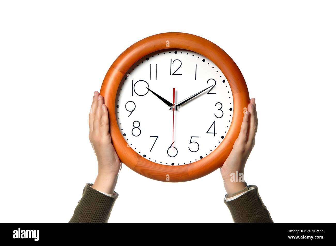 woman with a clock isolated in white background Stock Photo - Alamy