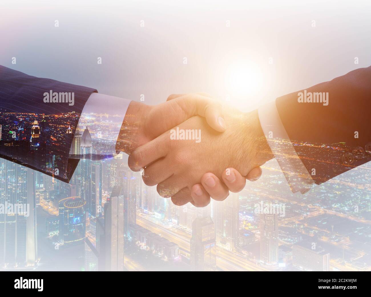 The concept of cooperation with handshake Stock Photo - Alamy