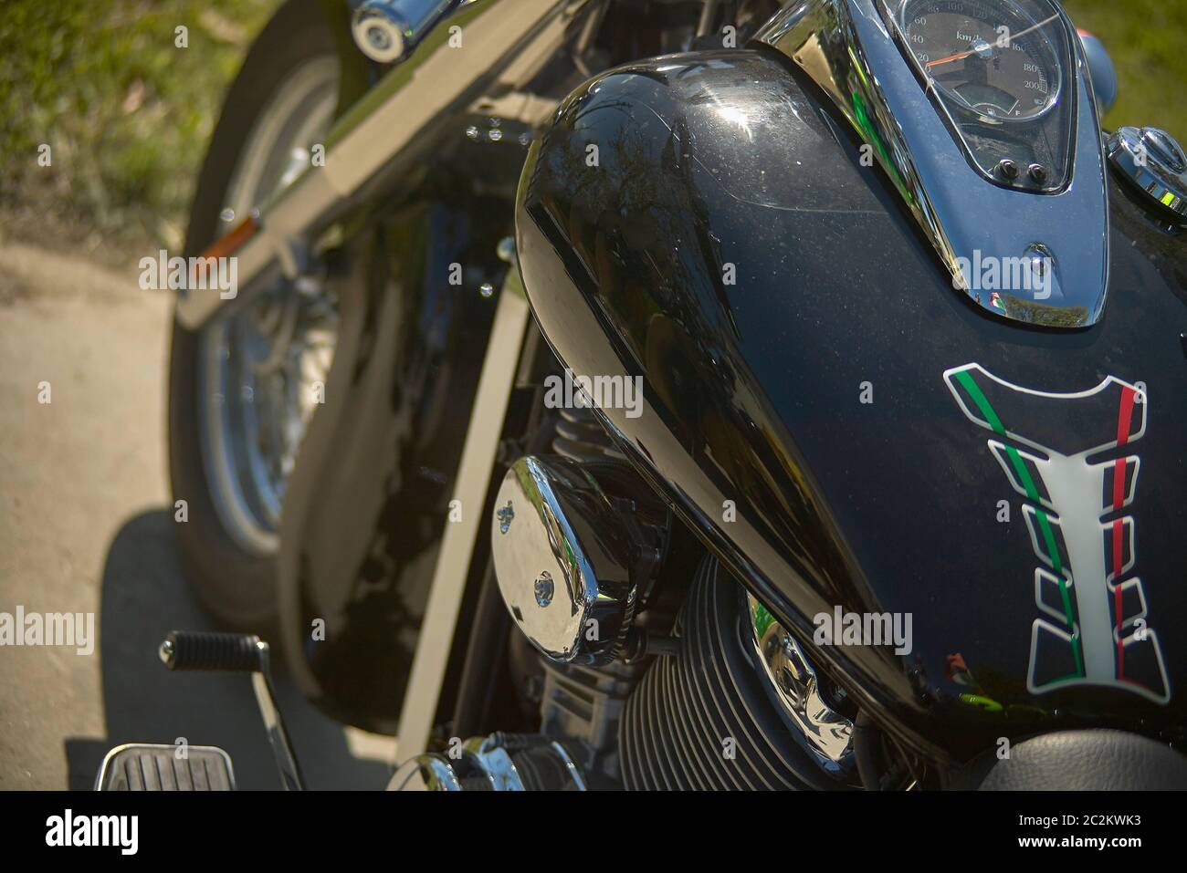 detail of the tank and part of the engine head of a custom black bike ...