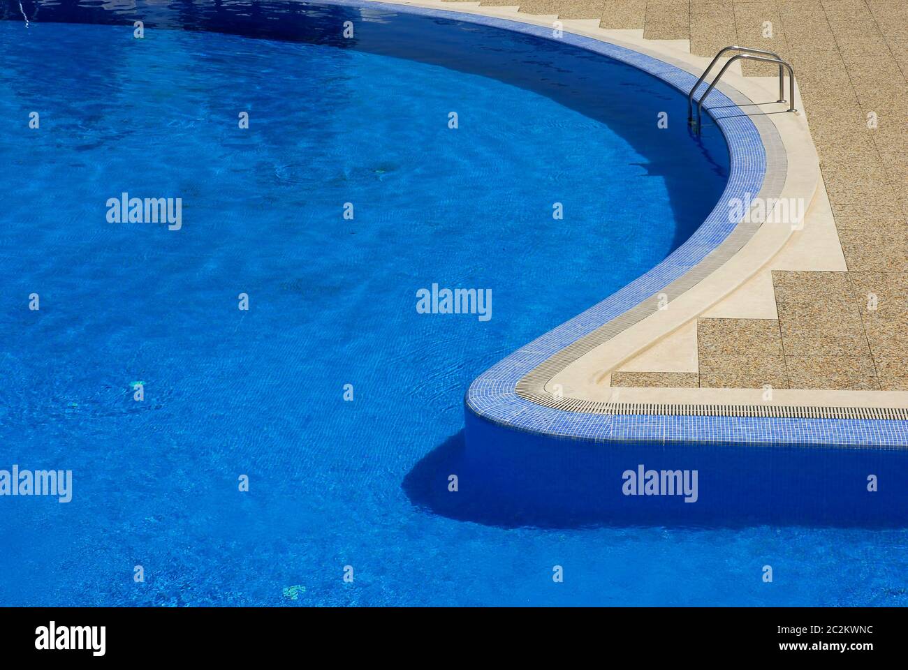 swimming pool blue water in a summer day Stock Photo - Alamy