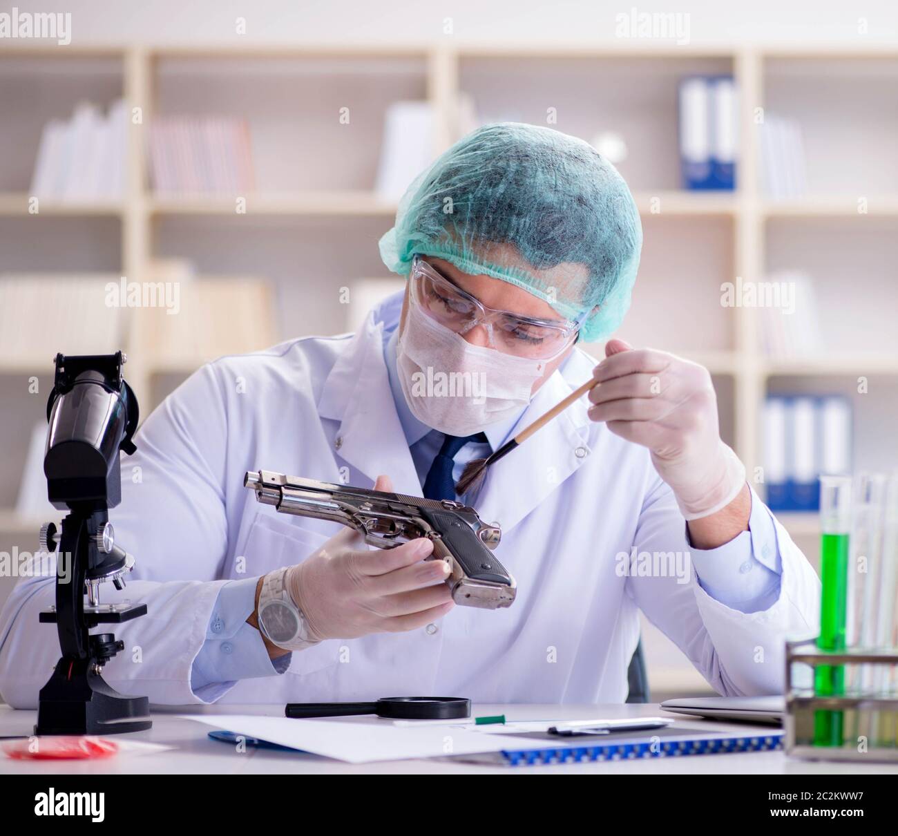 The forensics investigator working in lab on crime evidence Stock Photo ...
