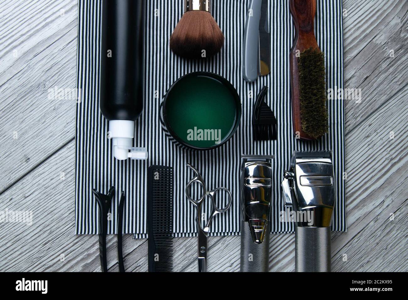 Flat lay from hairdressing accessories including: haircuts, scissors ...