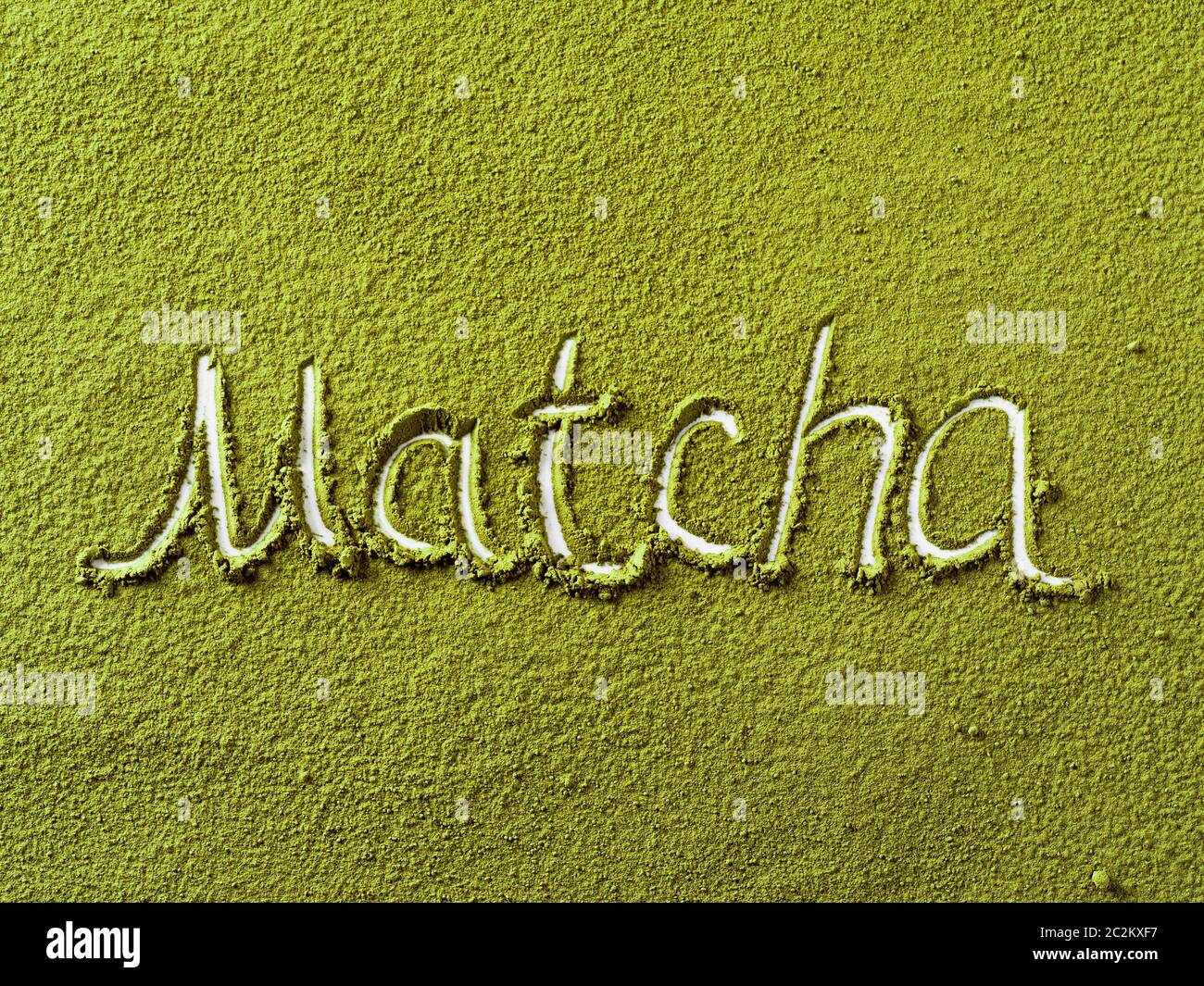 Matcha word over green matcha tea powder background. Top down view or ...
