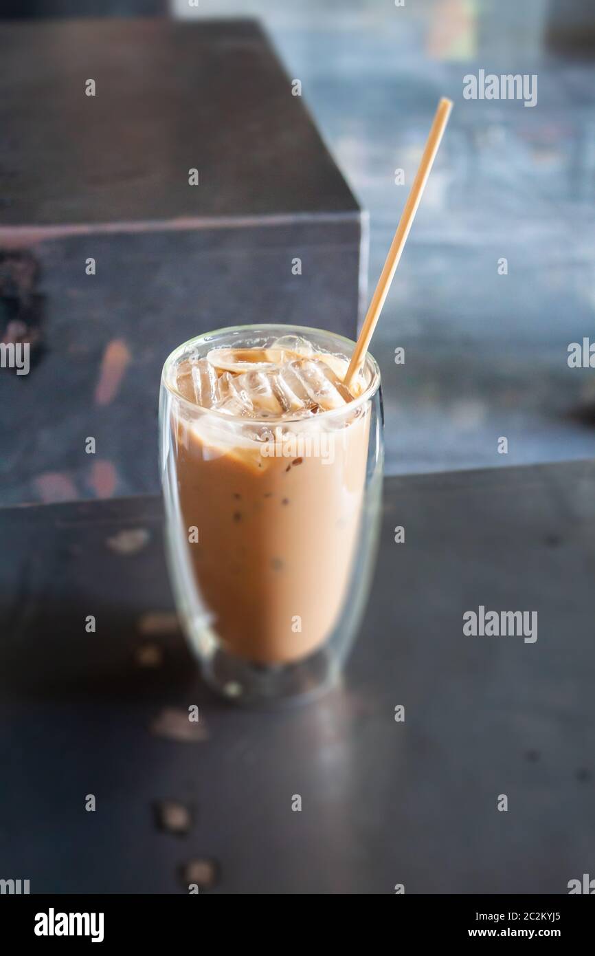 Iced coffee in coffee shop on wooden table, stock photo Stock Photo - Alamy