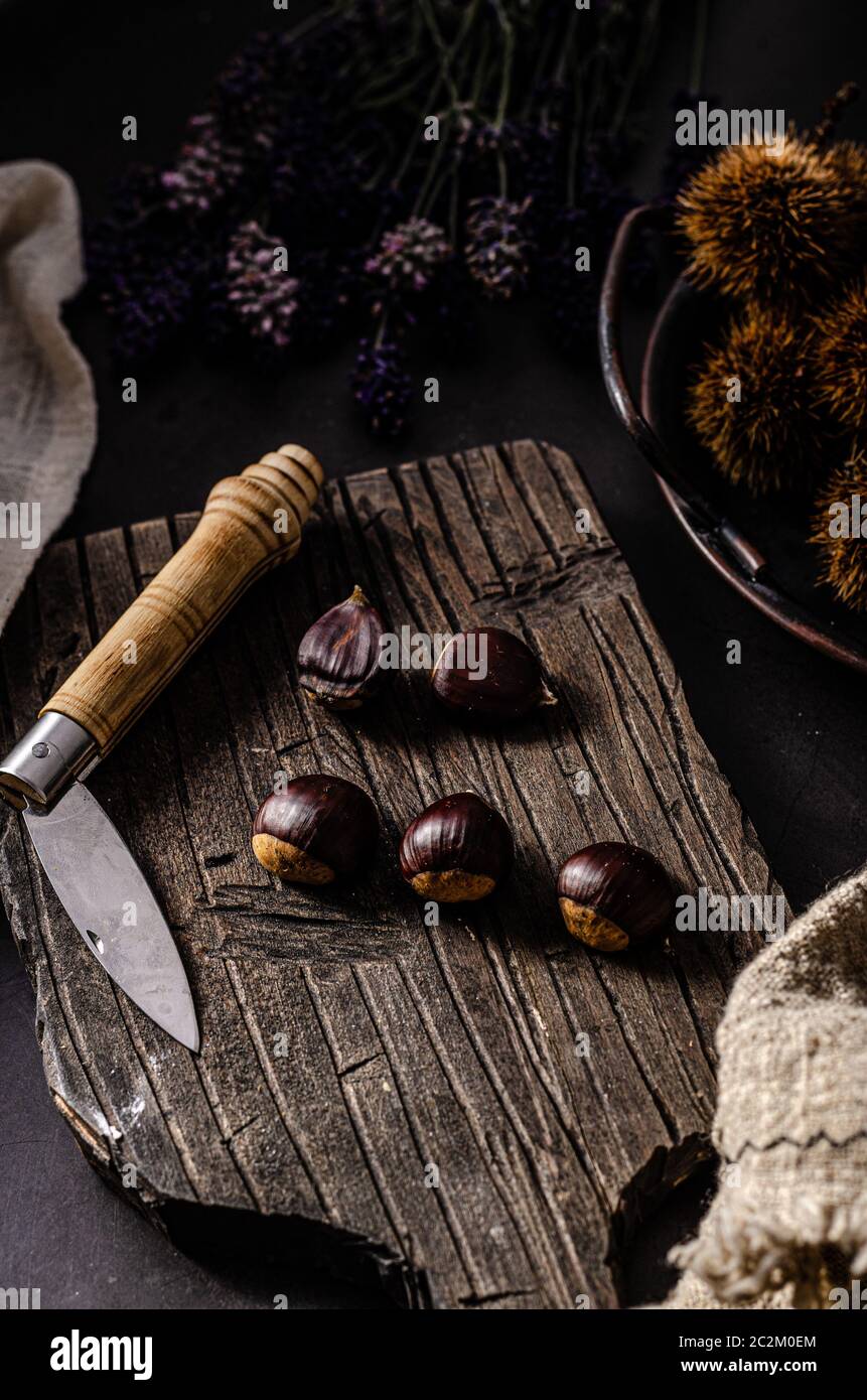 Chestnuts product photography with old knife and cutting board Stock ...