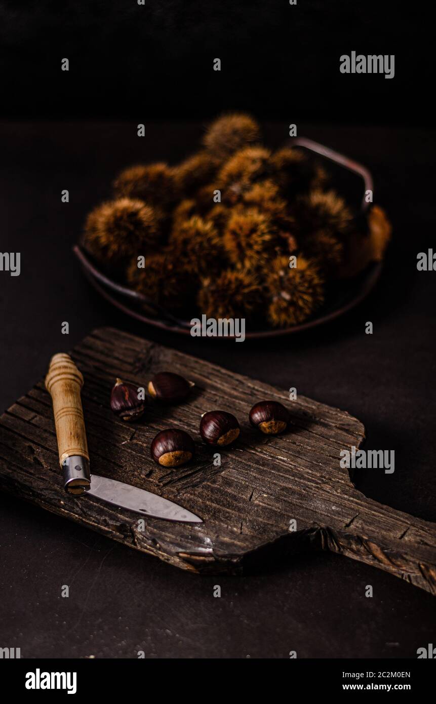 Chestnuts product photography with old knife and cutting board Stock ...
