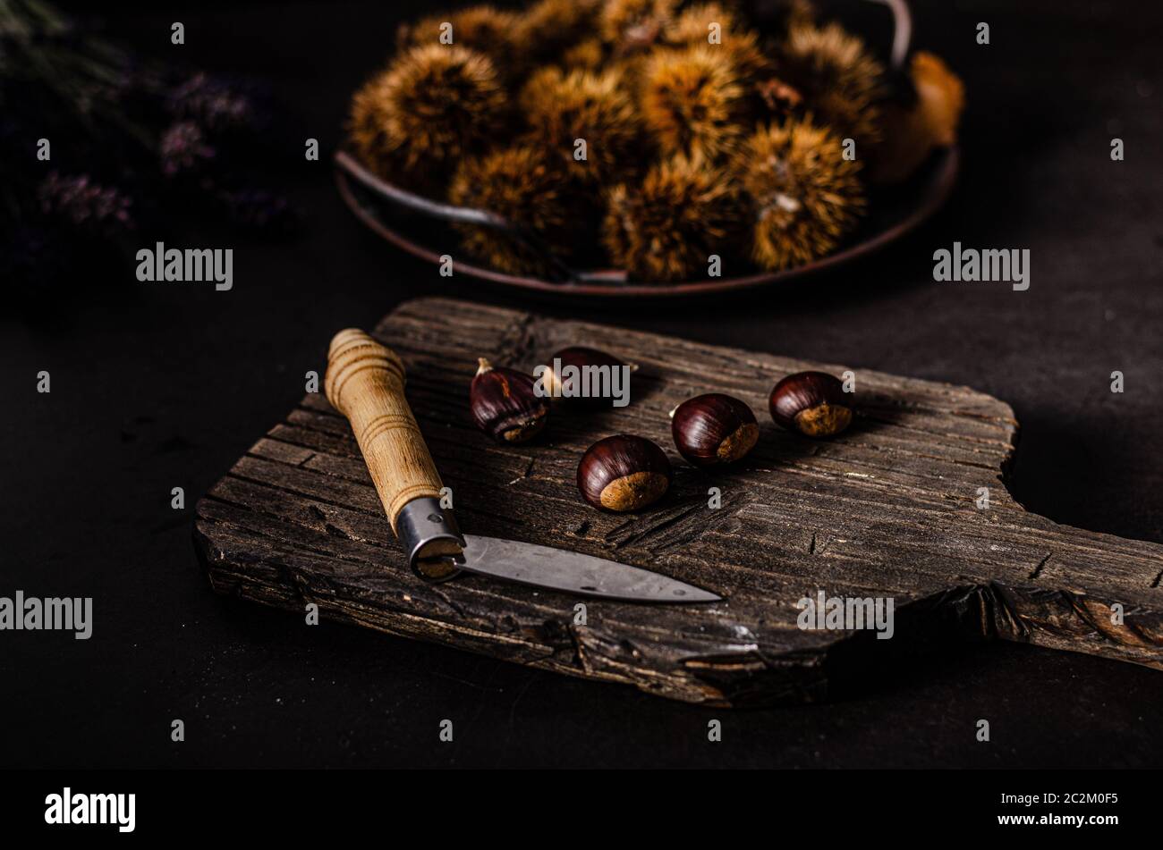 Chestnuts product photography with old knife and cutting board Stock ...