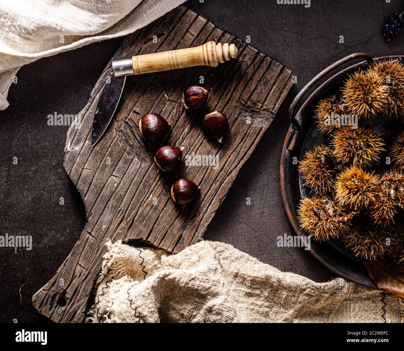 Chestnuts product photography with old knife and cutting board Stock ...