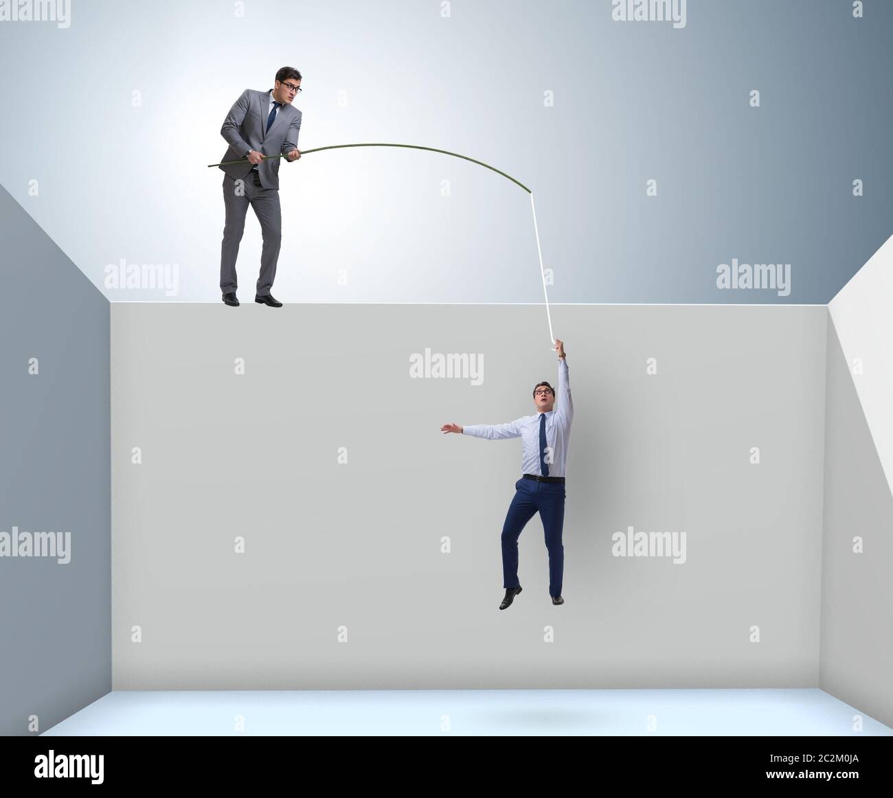 Businessman fishing his colleague in business concept Stock Photo - Alamy