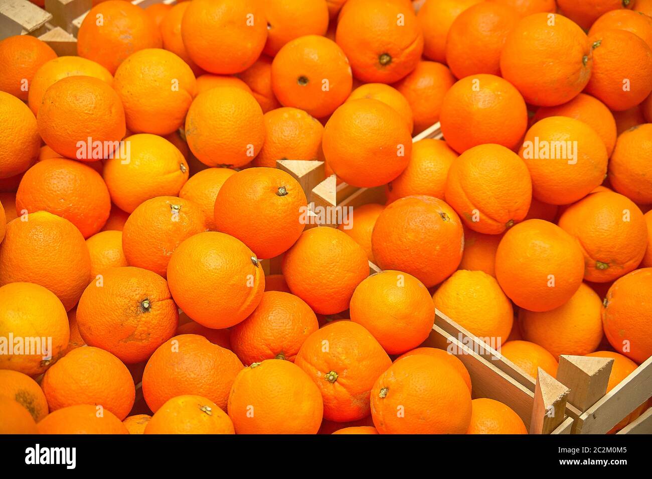Oranges texture: Storage of oranges inside wooden boxes ready to be ...