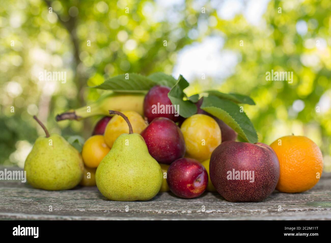 fruits in wooden table, outdoor Stock Photo - Alamy